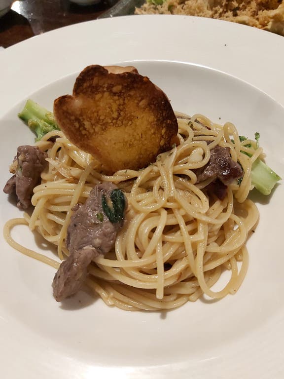 Spaghetti with smoked beef stock image. Image of dish - 250569169