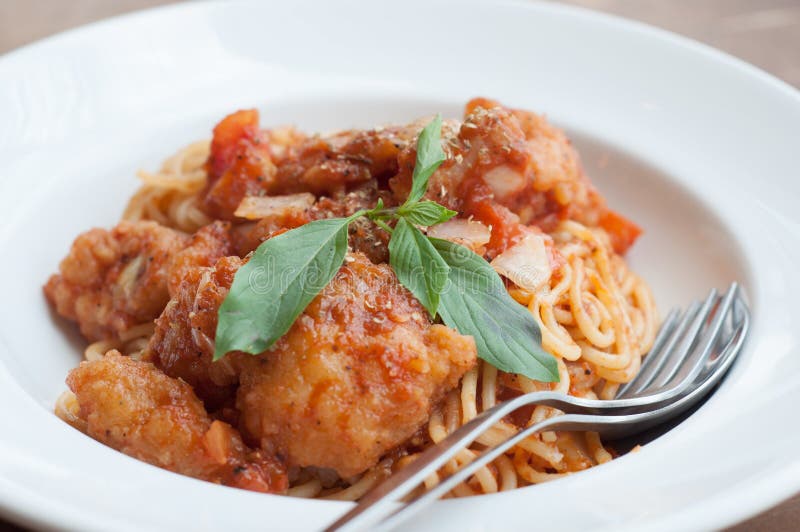 Spaghetti with Spicy Fried Fish on Sauce Stock Photo - Image of sauce ...
