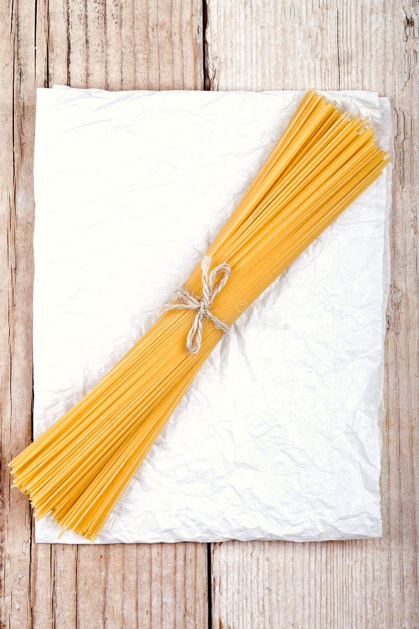 Spaghetti on white paper stock photo. Image of long, groceries - 38671452
