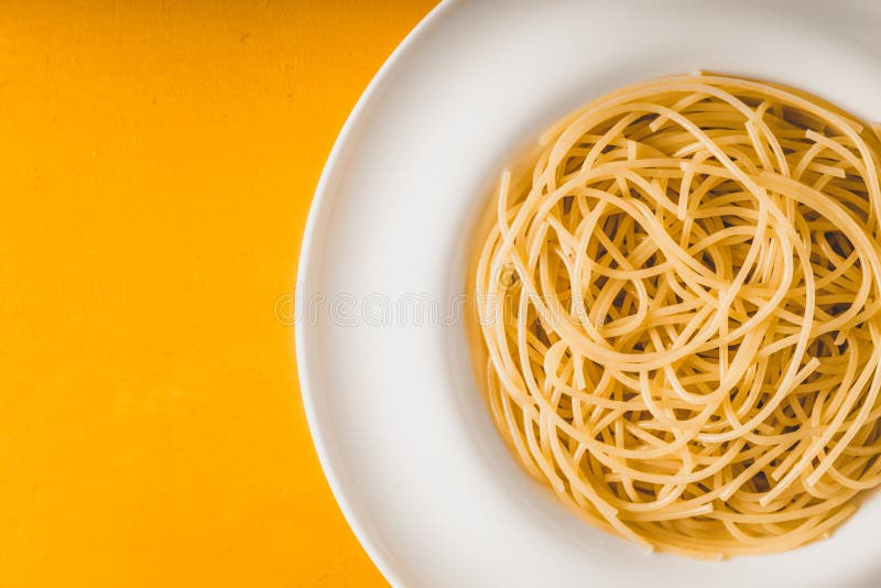 Raw and Cooked Spaghetti on the White Wooden Table Top View Stock Image ...