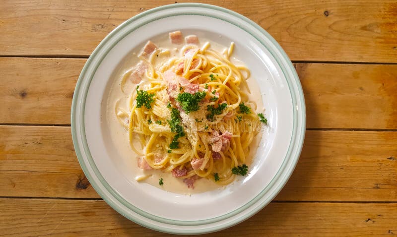 Spaghetti on wooden table stock photo. Image of foods - 113540266
