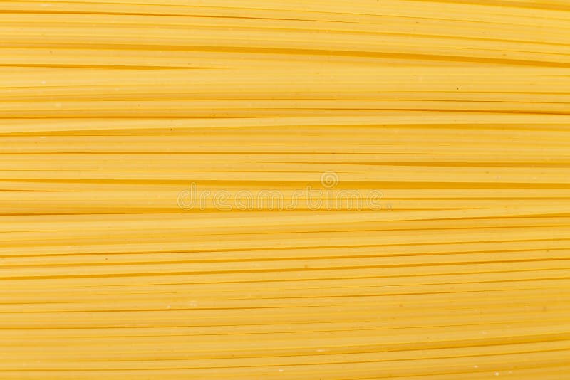 Spaghetti Yellow Background Close. Raw Pasta Macro Stock Image - Image ...
