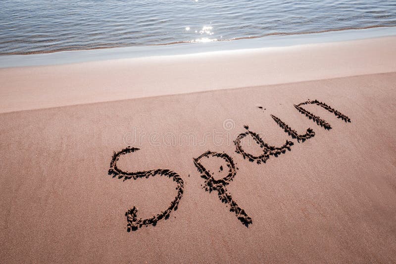 Spain Title on the Sand Beach Near the Ocean Stock Photo - Image of ...