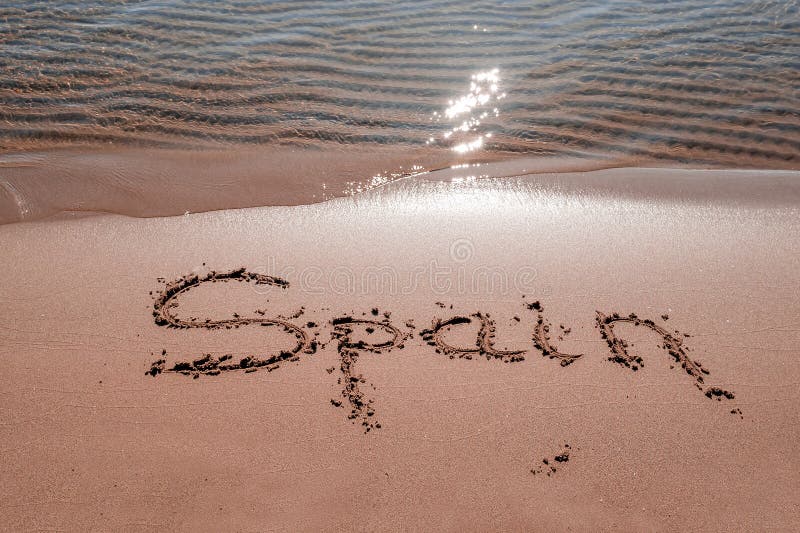 Spain Title on the Sand Beach Near the Ocean Stock Photo - Image of ...