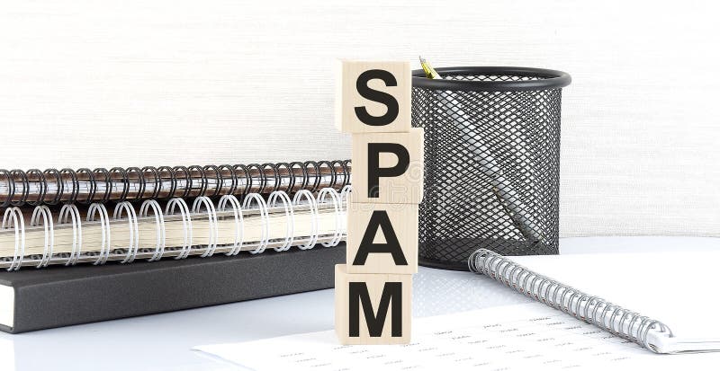 SPAM Text on Wooden Block with Notebooks on White Background Stock ...