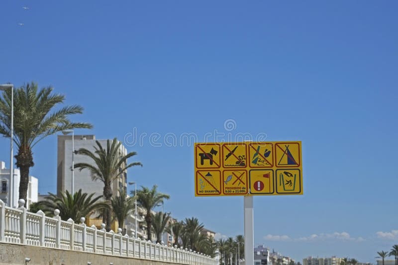 Spanish Beach Warning Signs Stock Image - Image of spanish, palm: 63505205