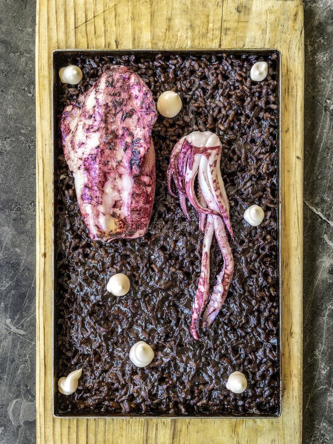 Spanish Black Rice (Arroz Negro a La Llauna) with Squid, Cooked on a ...