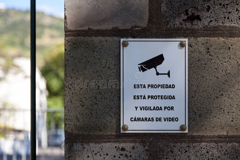 Spanish CCTV warning sign stock image. Image of protegida - 294353081