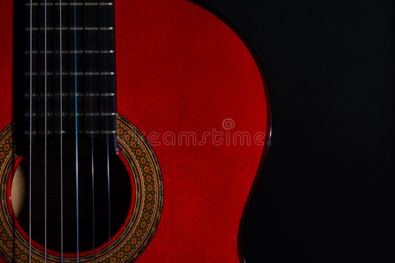 Spanish Classical Red Guitar Close-up on a Black Background Stock Image ...