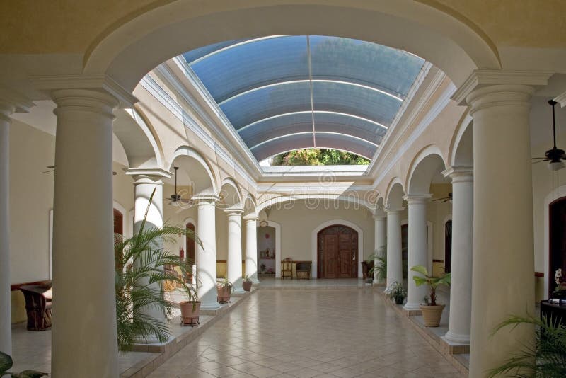 Spanish Colonial Building Interior Stock Image - Image of columns, arch ...