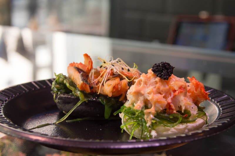 Spanish Crab and Caviar Montadito Stock Photo - Image of olive ...