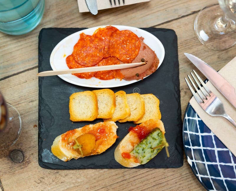 Spanish Cuisine. Variety of Tapas on Black Stone Stock Image - Image of ...