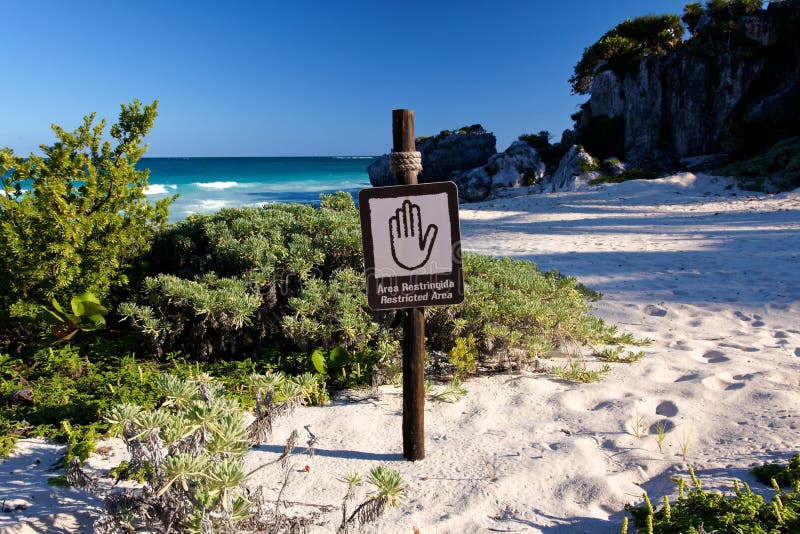 Spanish English Sign Restricted Area at Beach Stock Photo - Image of ...