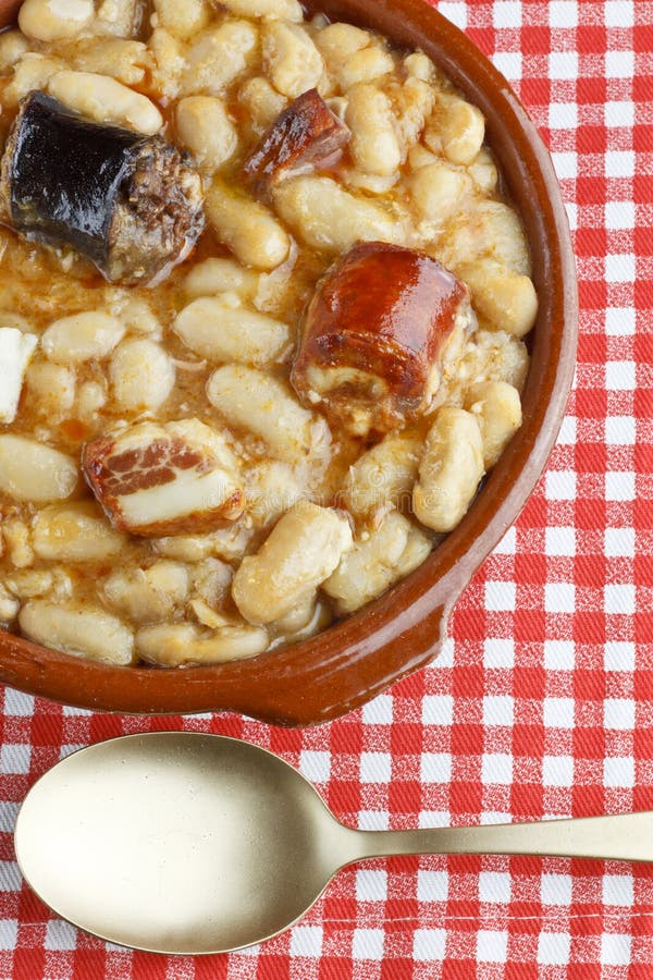 Spanish Fabada in an Earthenware Dish on a Red and White Tablecloth ...