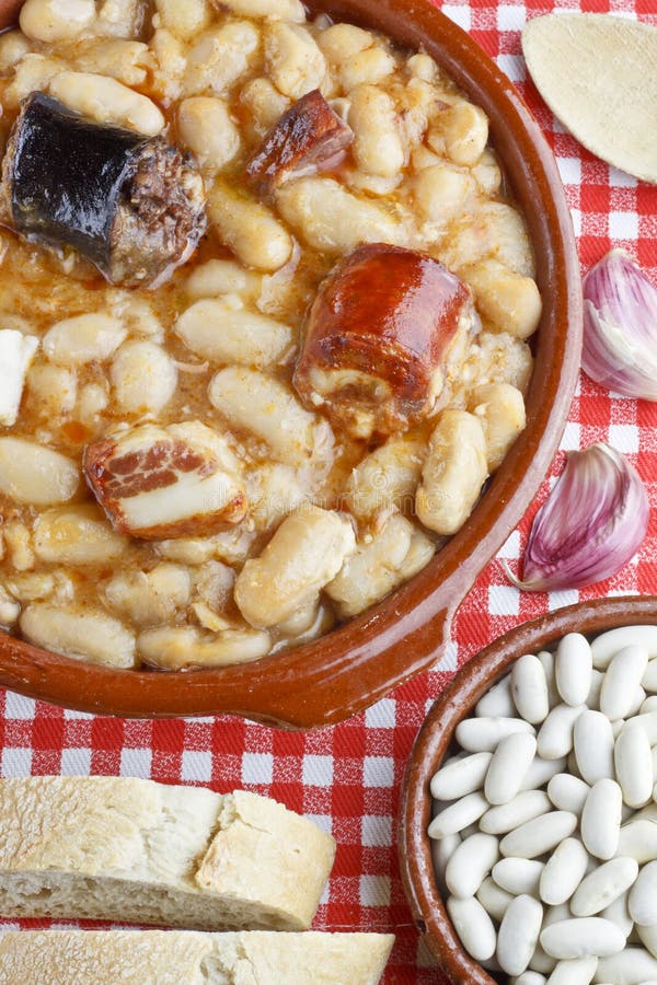 Spanish Fabada in an Earthenware Dish with Ingredients Stock Image ...