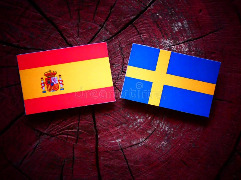 Spanish Flag with Swedish Flag on a Tree Stump Stock Image - Image of ...