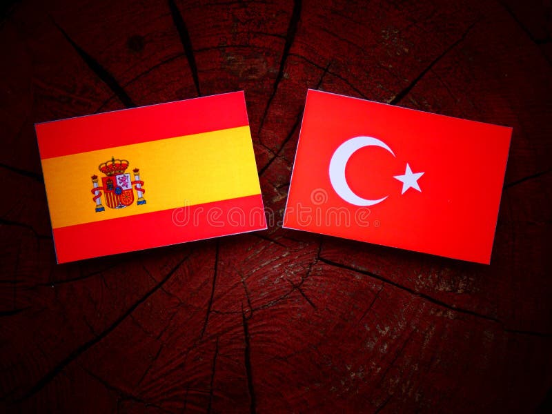 Spanish Flag with Turkish Flag on a Tree Stump Stock Photo - Image of ...