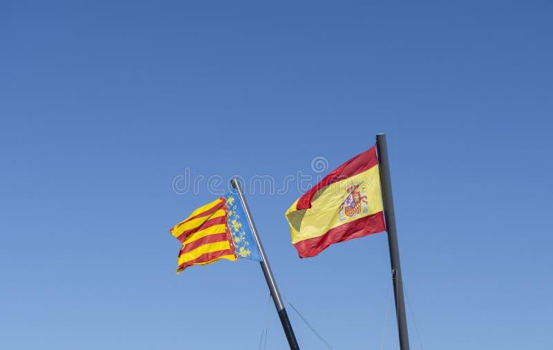 Spanish Flag and Valencian Community Flag Waving in Wind ,Port of ... Spanish Flag and Valencian Community Flag Waving in Wind ,Port of ...