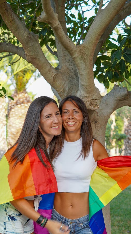 Spanish Lesbian Couple Posing with a Pride Flag Stock Image - Image of ...