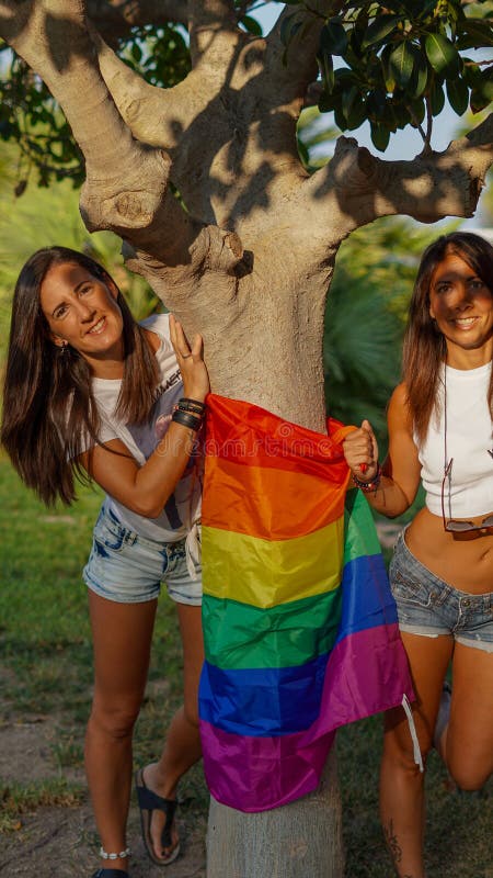 Spanish Lesbian Couple Posing with a Pride Flag Stock Photo - Image of ...