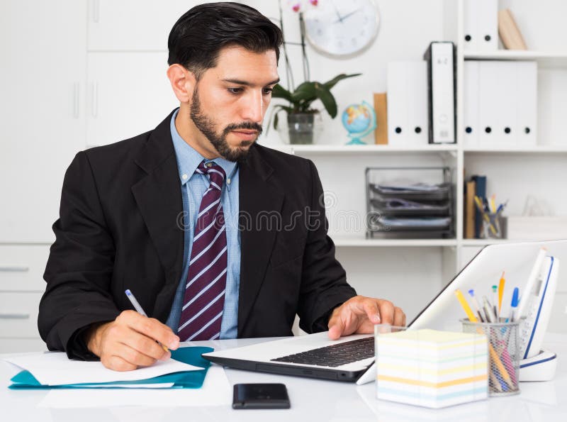 Spanish Man is Working with Documents in Laptop Stock Photo - Image of ...
