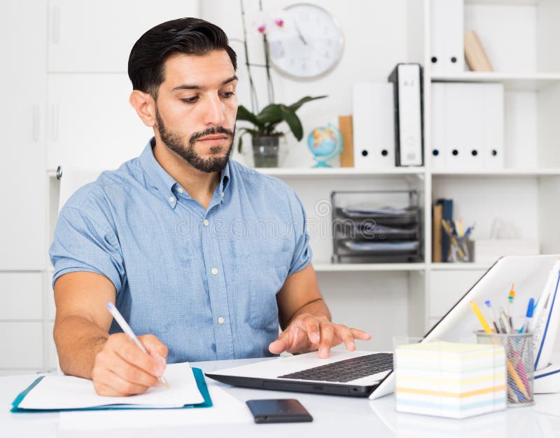 Spanish Man is Working with Documents in Laptop Stock Photo - Image of ...