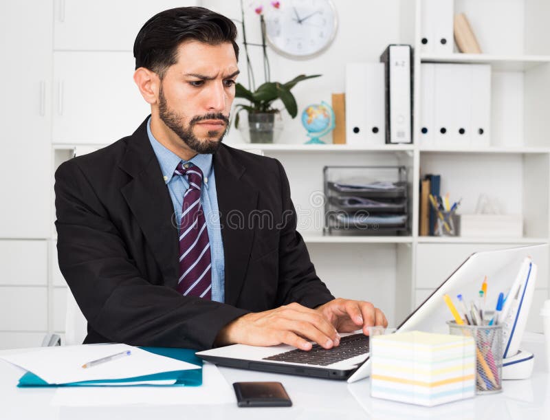 Spanish Man is Working with Documents in Laptop Stock Image - Image of ...