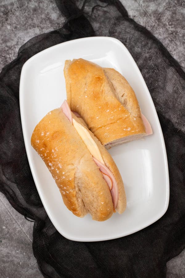 A Spanish Rosca De Jamon Serrano, Ham Sandwich, on a White Plate Stock ...