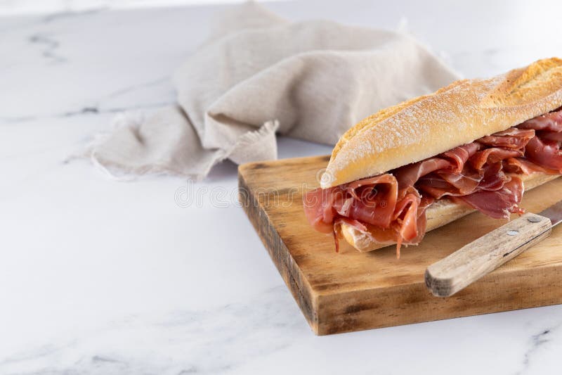 Spanish Serrano Ham Sandwich on White Marble Background Stock Image ...