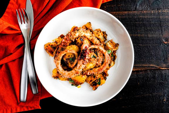 Spanish Style Octopus with Potatoes Stock Photo - Image of dressing ...