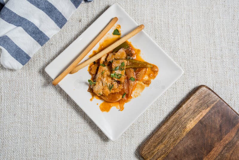 Spanish Tapa of Fish with Orange Sauce and Bread Sticks Stock Image ...