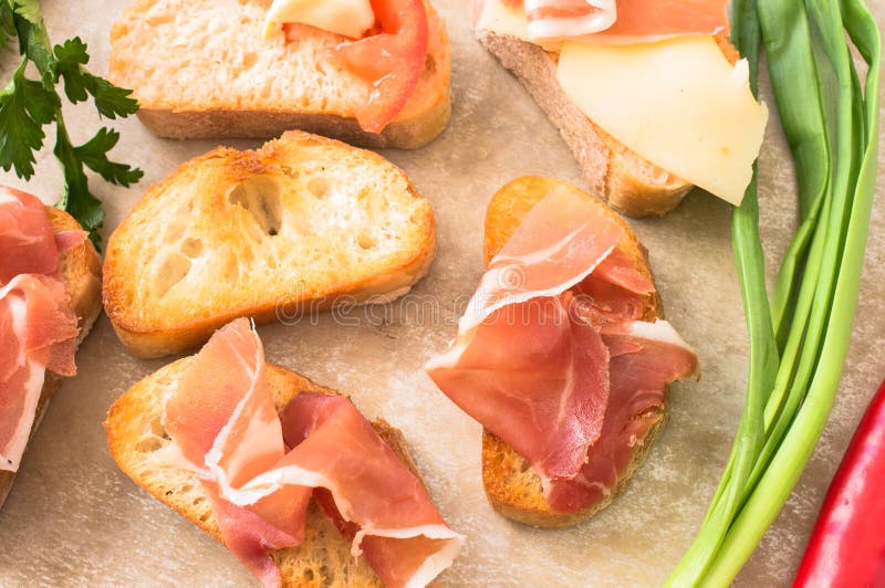 Spanish Tapas with Jamon, Cheese, Tomato and Garlic Stock Photo - Image ...