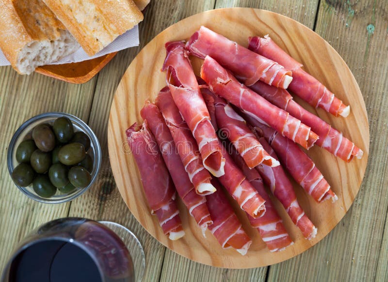 Spanish Tapas - Rolls of Jamon Serrano Served on Wooden Board Stock Image - Image of delicacy ...