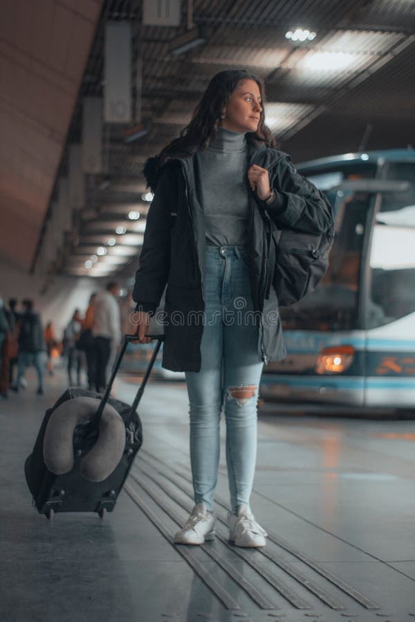 Spanish Woman in Black Coat at a Bus Station Stock Photo - Image of ...