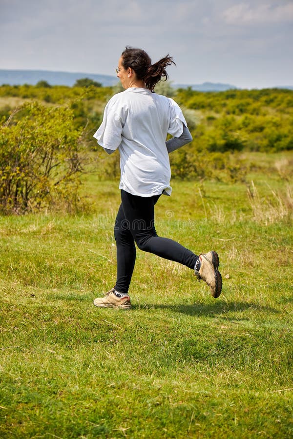 Spanish Woman Running on Meadow Stock Photo - Image of marathon, runner ...
