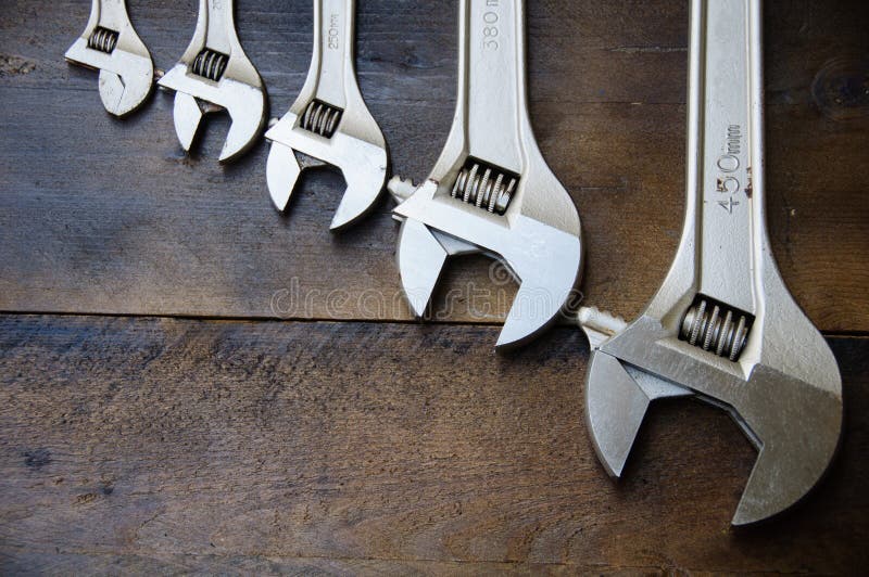 Spanner or Adjustable Wrench on Wooden Back Ground, Basic Hand Tools ...