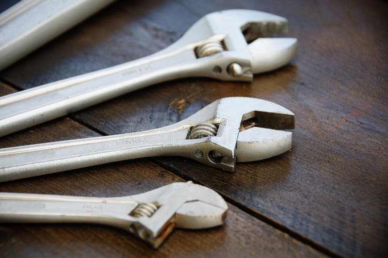 Spanner or Adjustable Wrench on Wooden Back Ground, Basic Hand Tools ...