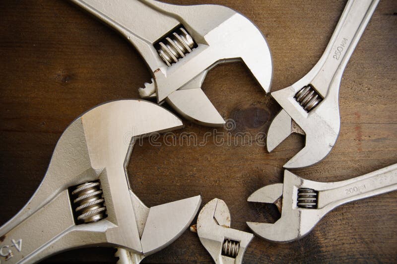 Spanner or Adjustable Wrench on Wooden Back Ground, Basic Hand Tools ...