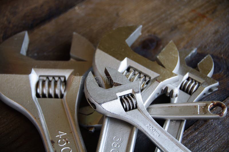 Spanner or Adjustable Wrench on Wooden Back Ground, Basic Hand Tools ...