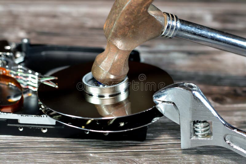 Spanner Wrench and Steel Hammer with HDD Platters, Hard Disk Drive ... Spanner Wrench and Steel Hammer with HDD Platters, Hard Disk Drive ...
