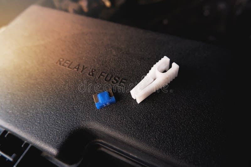 The Spare Fuse and the Fuse Clip Tool on the Car Fuse Box Stock Photo ...