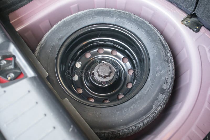 Spare Tire in the Modern Compact Car Stock Image - Image of metal ...