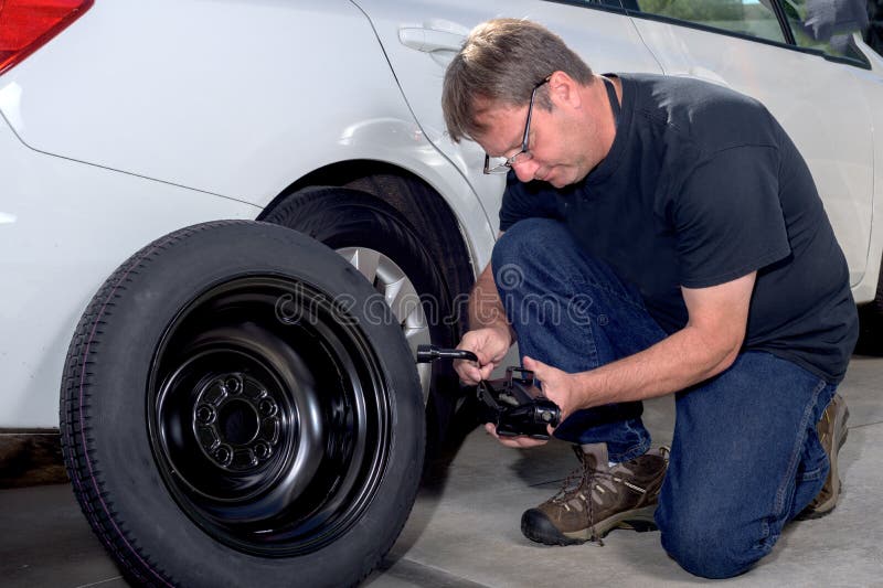 Spare Tire with Jack in Trunk of a Car Stock Photo - Image of detail ...