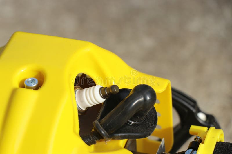 Spark Plug in the Engine Head of a Brush Cutter Machine. Spare Parts of ...