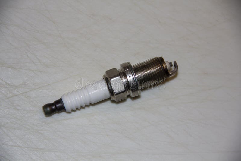 Spark Plug for Internal Combustion Engine on a Black Background. Stock ... Spark Plug for Internal Combustion Engine on a Black Background. Stock ...