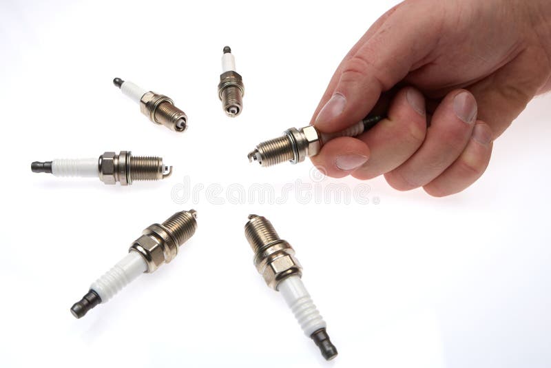 4 Spark Plugs with a Magnifying Glass Stock Image - Image of assembly ...
