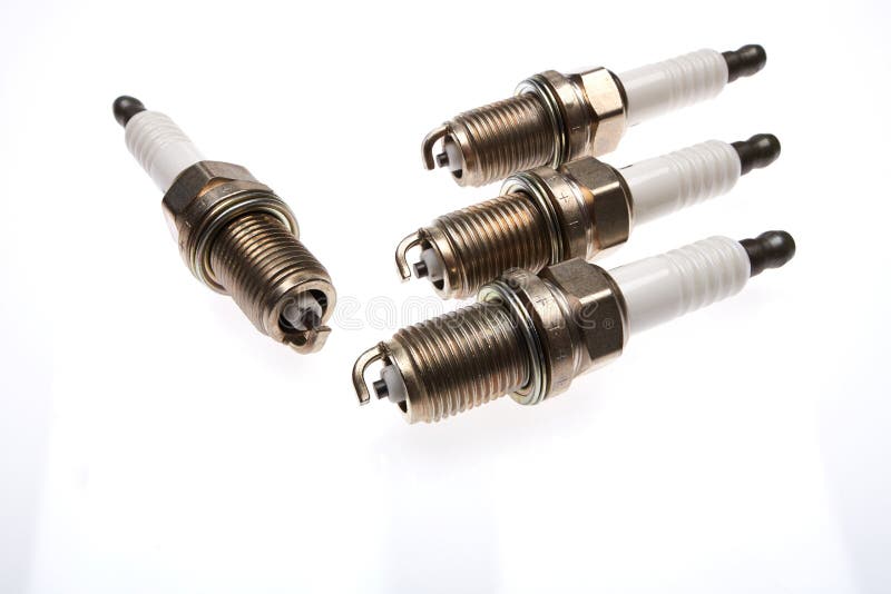 4 Spark Plugs with a Magnifying Glass Stock Image - Image of assembly ...