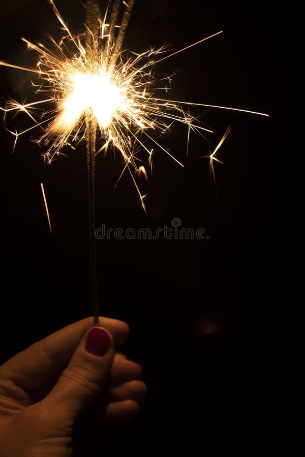 Sparklers in the Dark. Sparks with Fire in Hands on a Stick. Awesome ...