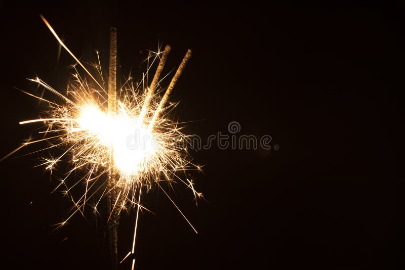 Sparklers in the Dark. Sparks with Fire in Hands on a Stick. Awesome ...