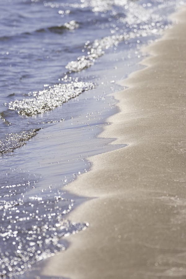 Sparkling Blue Water Waves Lapping Clean Sandy Beach, Vertical Stock ...